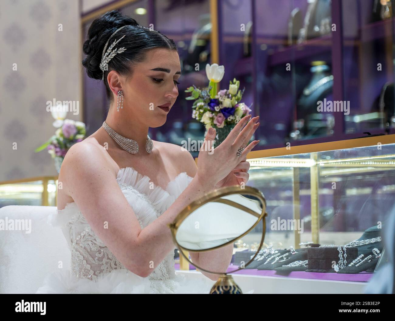 DOHA JEWELLERY AND WATCHES EXHIBITION A woman tries diamond jewellery ...