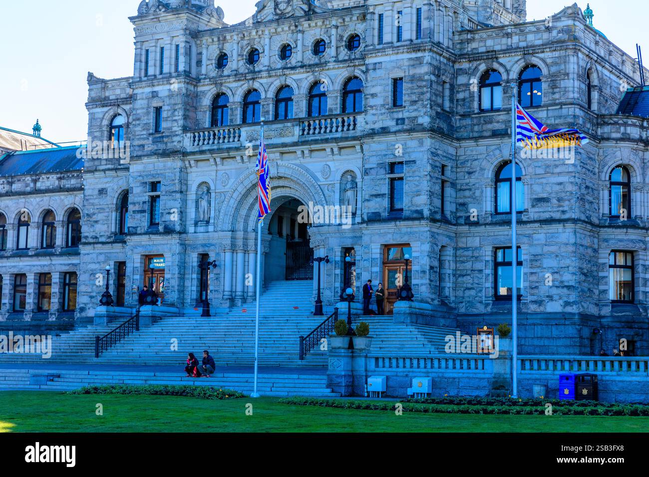 A large building with a flag on the front. The flag is blue and white ...