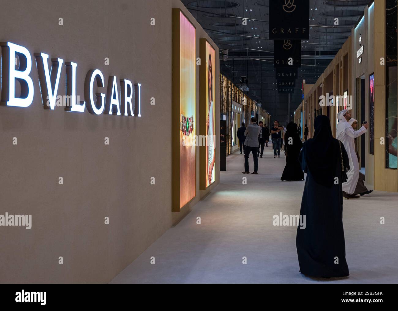 DOHA JEWELLERY AND WATCHES EXHIBITION Visitors stand next to the stand ...