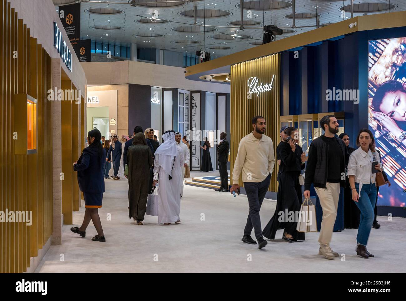 DOHA JEWELLERY AND WATCHES EXHIBITION People visit and look at gold and ...