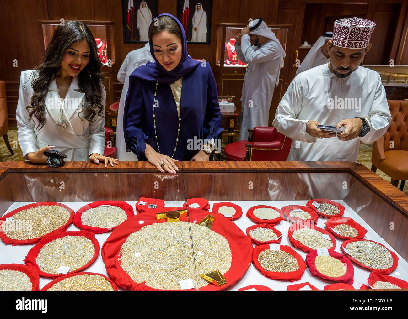 DOHA JEWELLERY AND WATCHES EXHIBITION Two women looking at a collection ...
