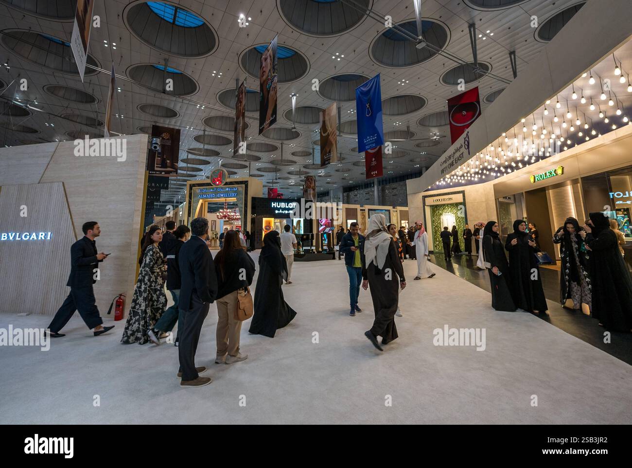 DOHA JEWELLERY AND WATCHES EXHIBITION People visit and look at gold and ...