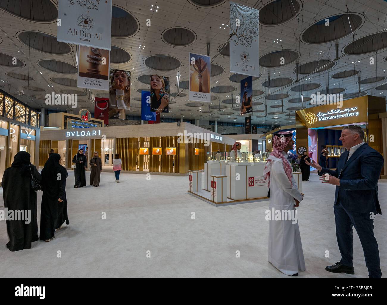 DOHA JEWELLERY AND WATCHES EXHIBITION People visit and look at gold and ...