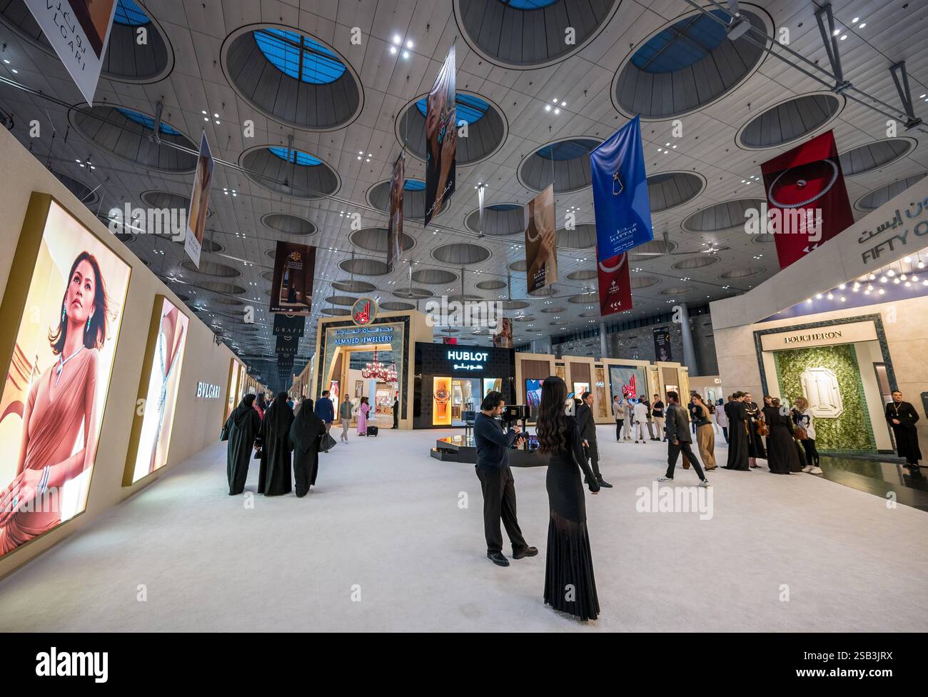 DOHA JEWELLERY AND WATCHES EXHIBITION People visit and look at gold and ...