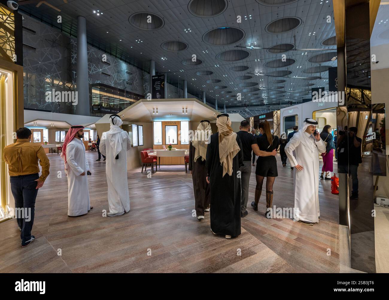 DOHA JEWELLERY AND WATCHES EXHIBITION People visit and look at gold and ...