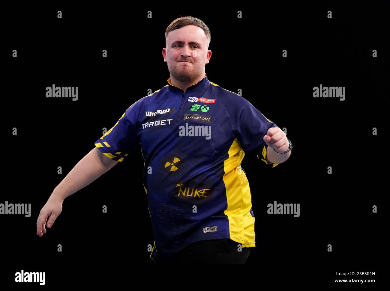 Luke Littler celebrates during his first round match against Andy ...