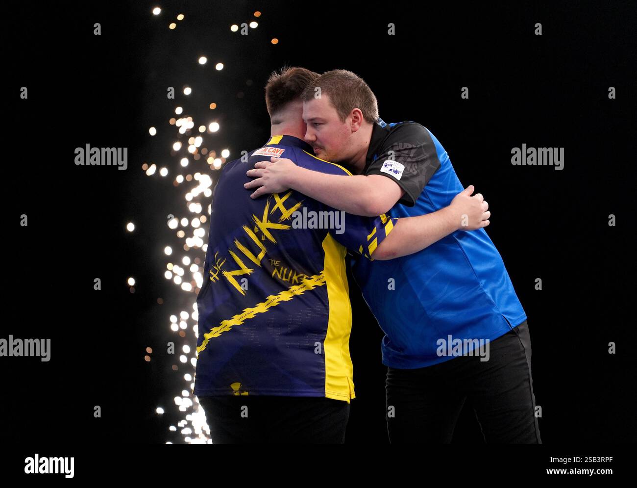 Andy Baetens and Luke Littler following their first round match on day ...