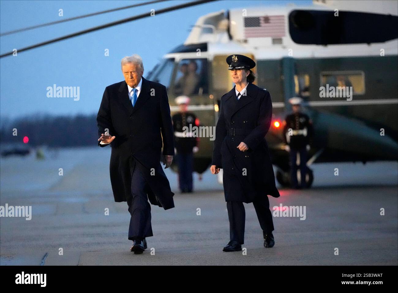 President Donald Trump walks with Col. Angela F. Ochoa, Commander, 89th ...