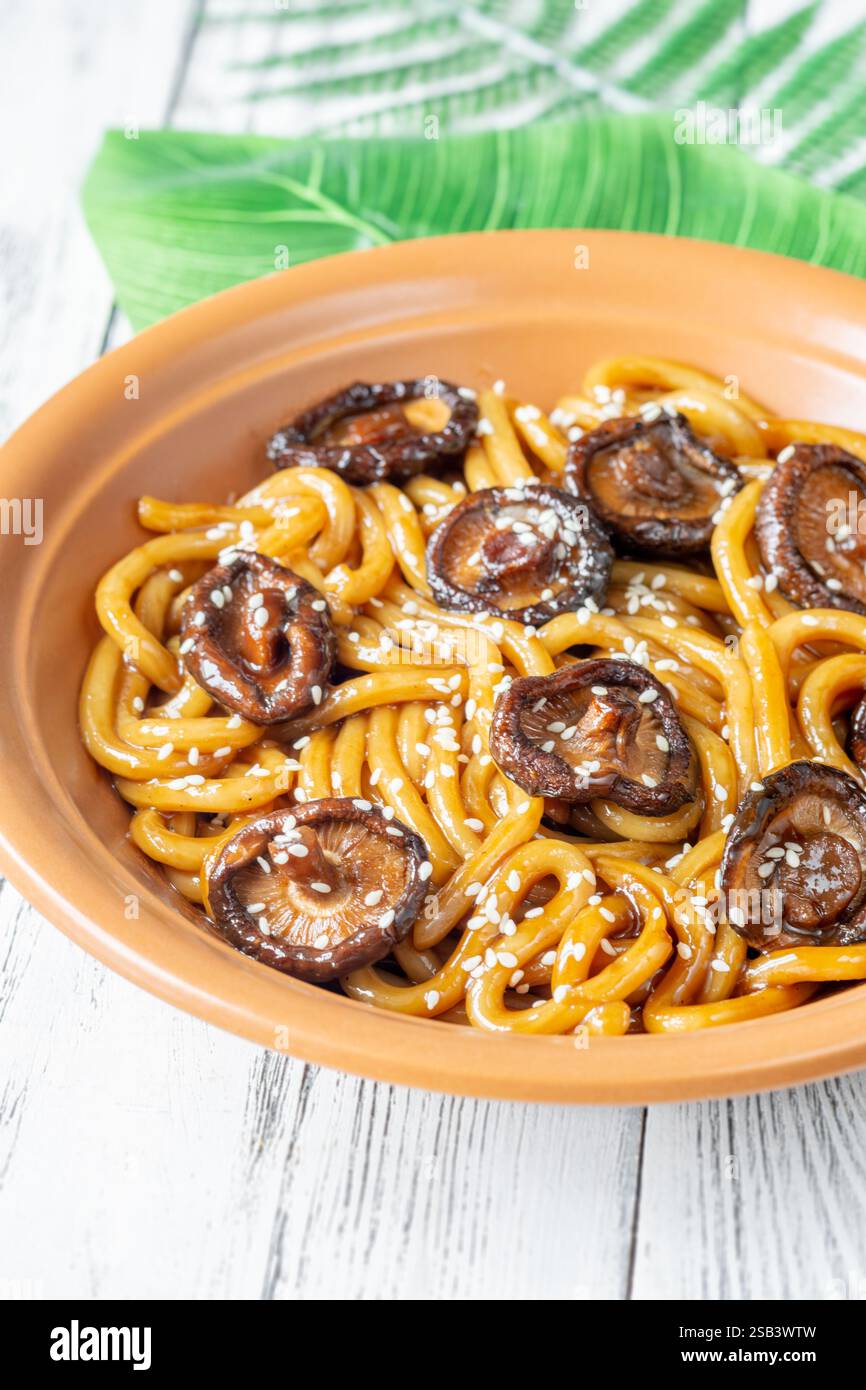 A portion of udon noodles with soy unagi mirin ginger sauce, shiitake ...