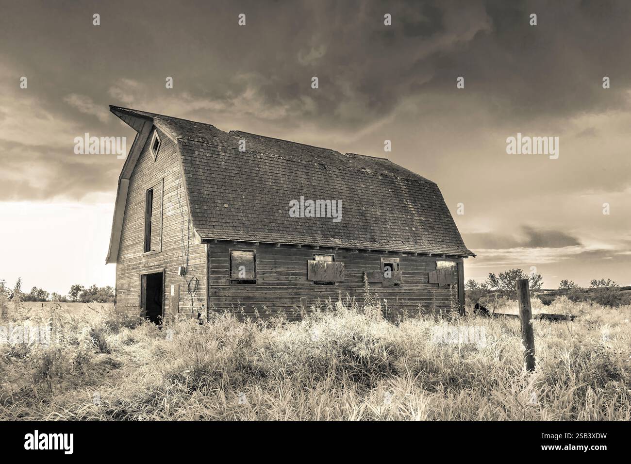 A barn with a slanted roof. The barn is old and has a lot of rust Stock ...