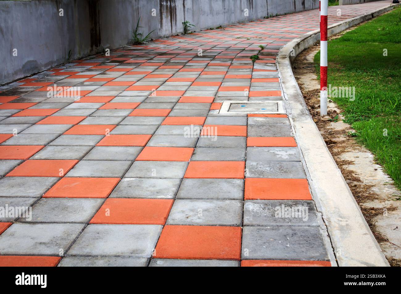 The Stone block walk path in the park with green grass background Stock ...
