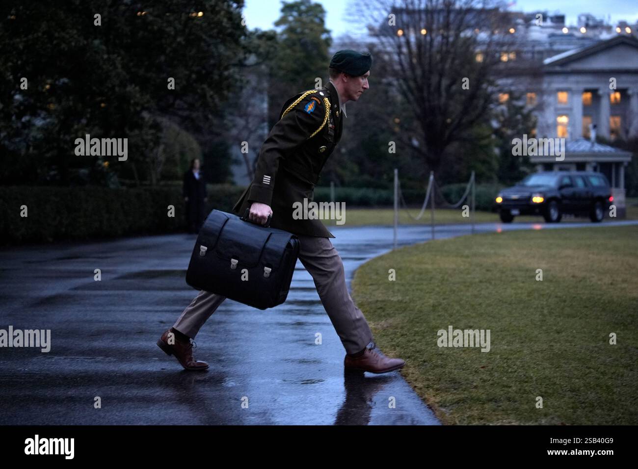 Washington, United States. 31st Jan, 2025. A military aide carries a ...
