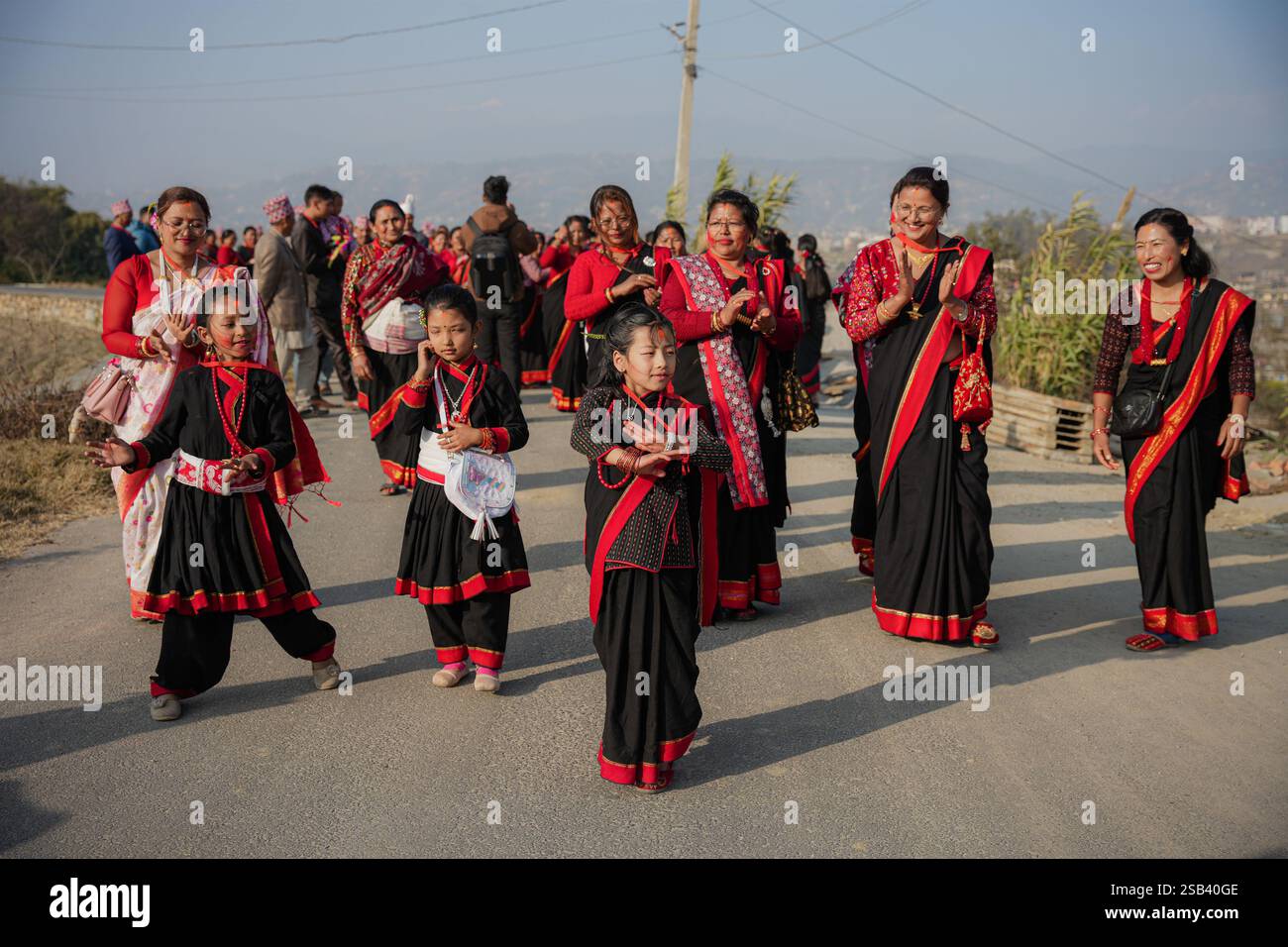 Members of the Newar community perform a dance accompanied by ...