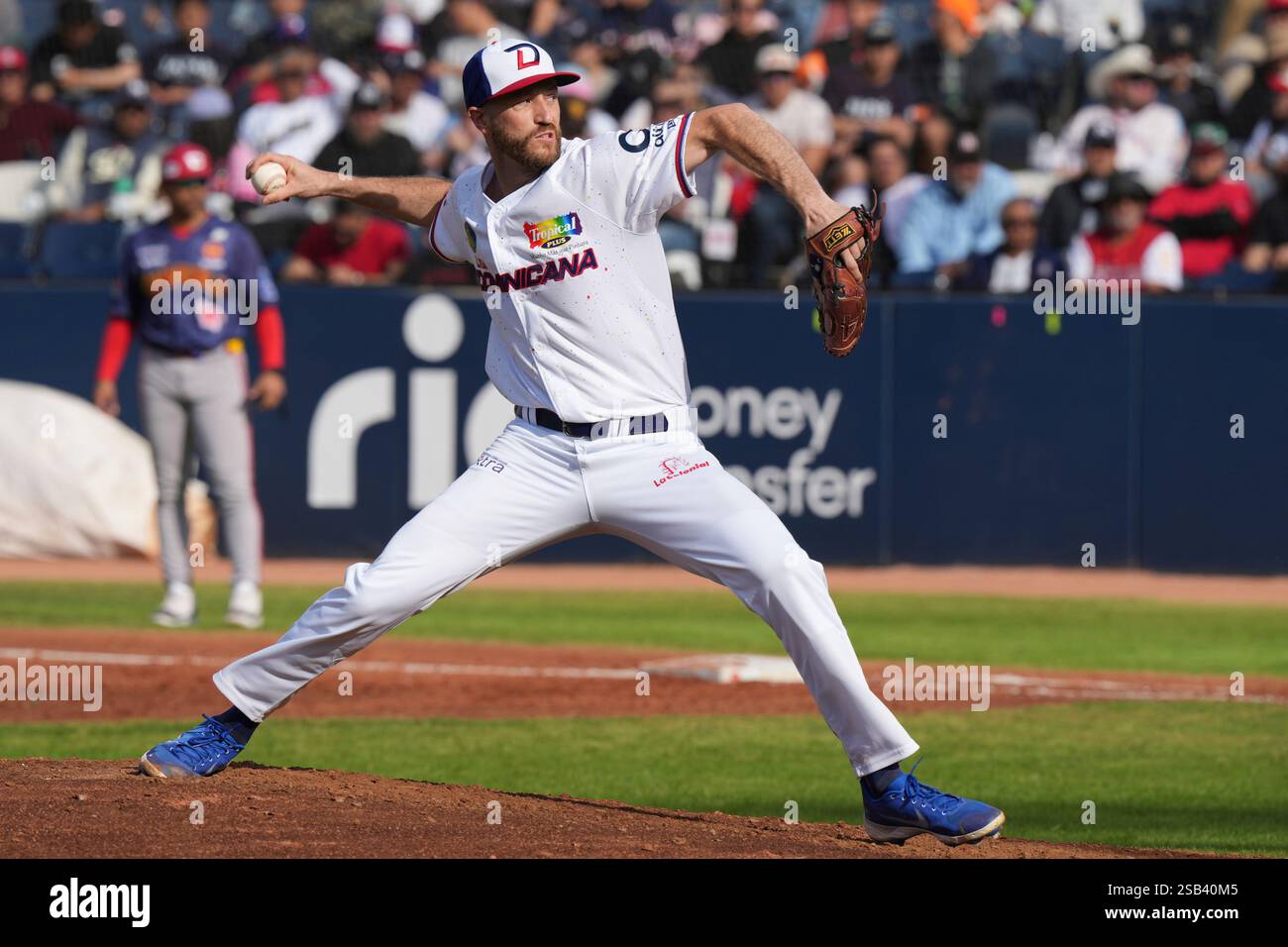 Dominican Republic's starting pitcher Brooks Hall throws against ...