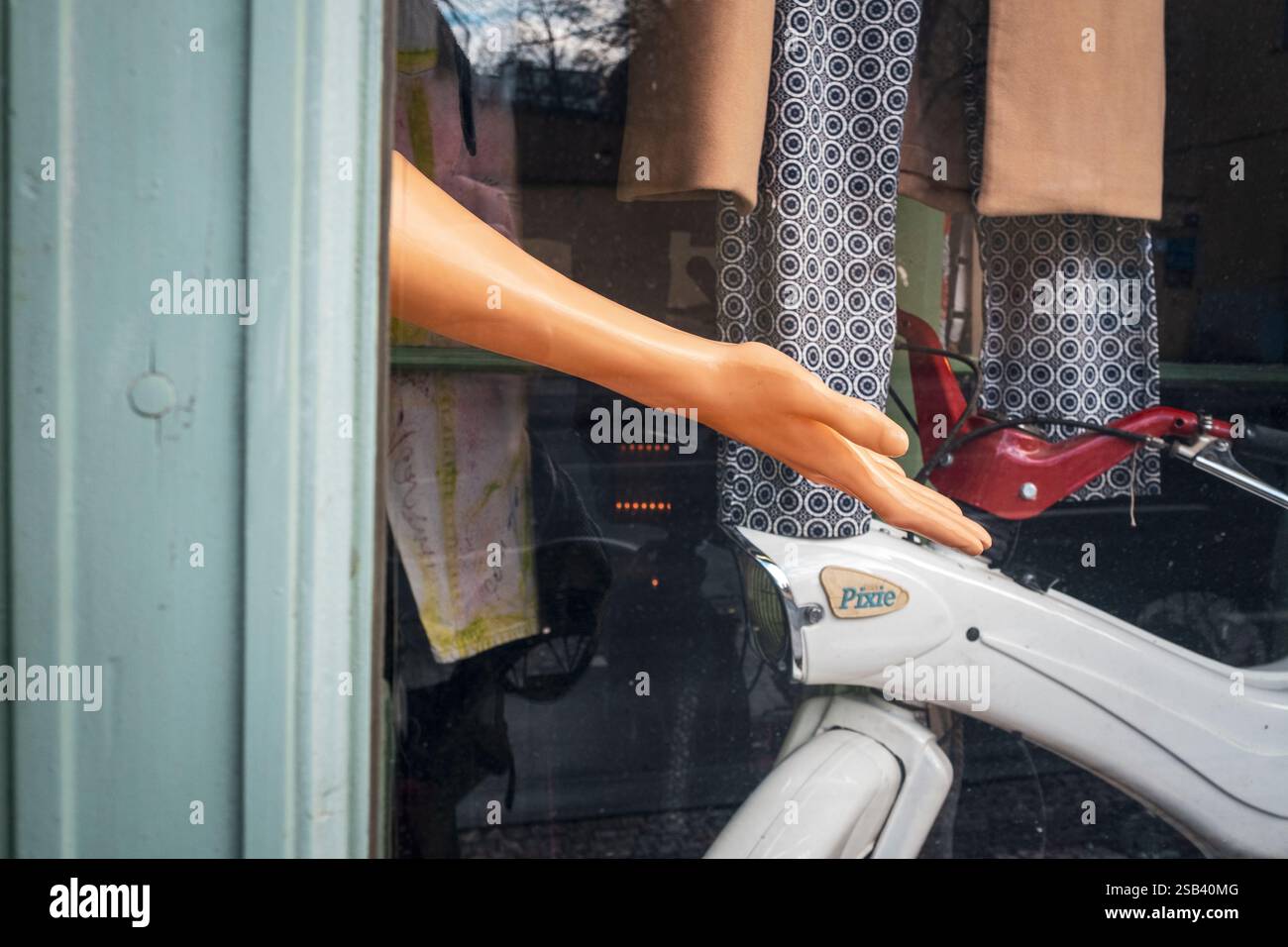 A plastic mannequin hand reaching out of a wall Stock Photo - Alamy