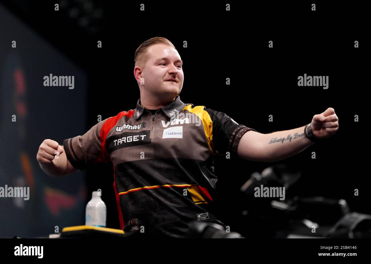 Dimitri Van den Bergh celebrates winning his first round match against ...