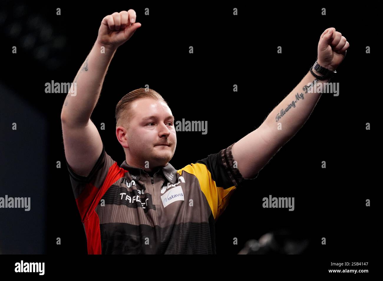 Dimitri Van den Bergh celebrates winning his first round match against ...