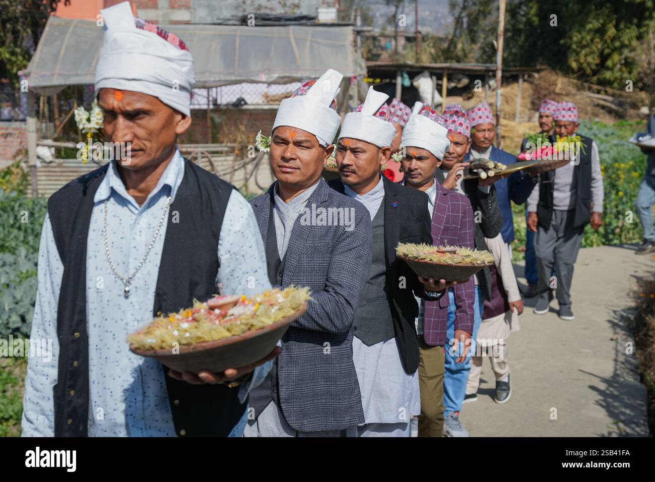 Members of the Newar community attend a religious ritual during the ...