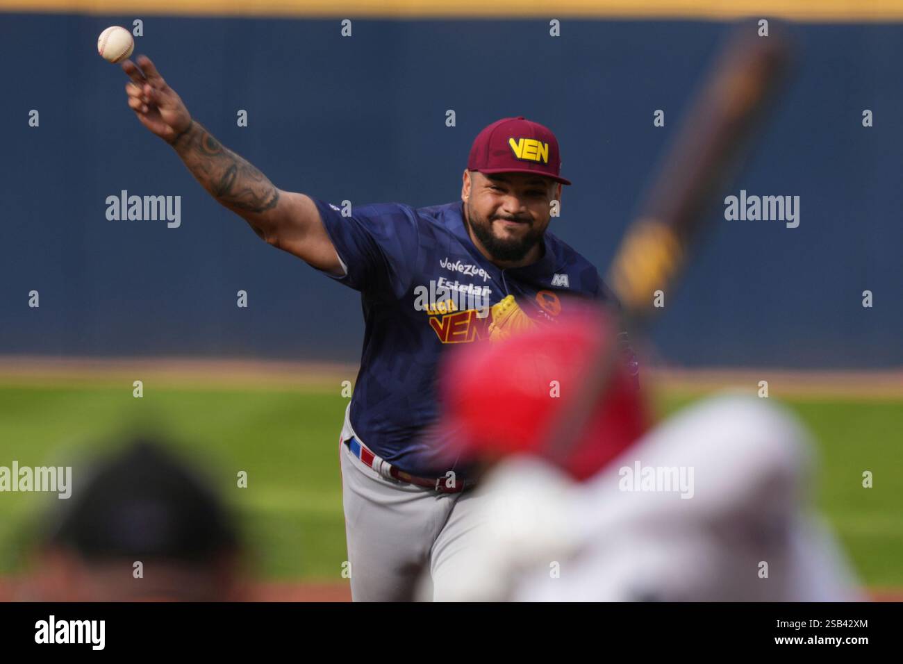 Venezuela's pitcher Max Castillo, top, throws against the Dominican ...