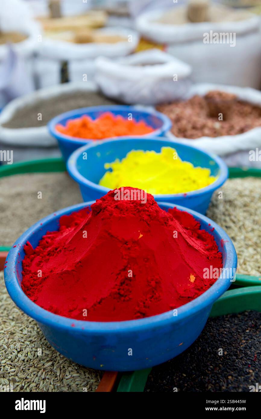 Kumkum powder at a market stall in Nepal. Kumkuma is a powder used for ...