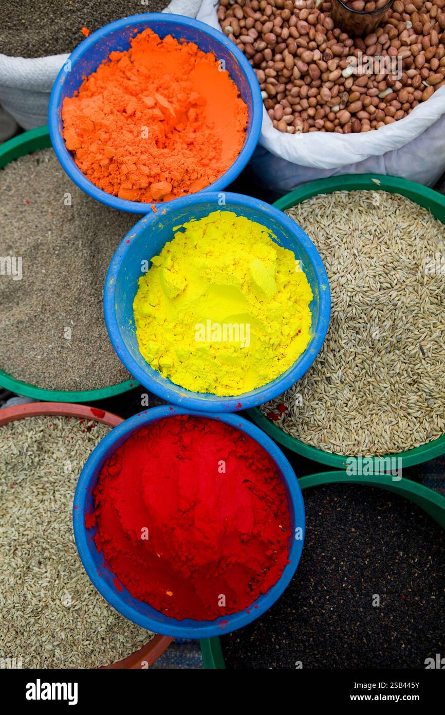 Kumkum powder at a market stall in Nepal. Kumkuma is a powder used for ...