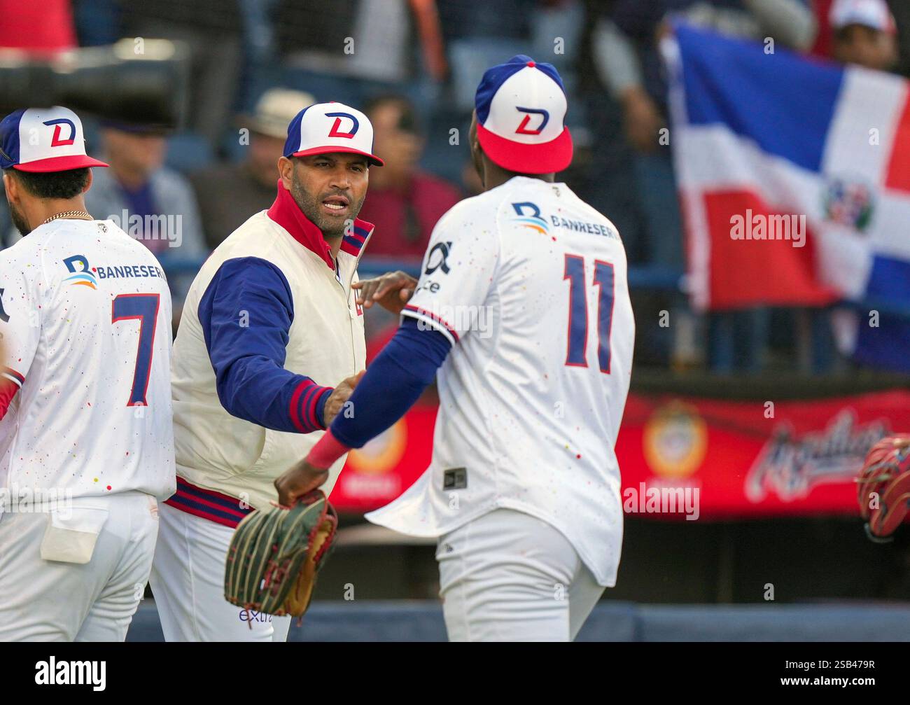 Dominican Republic's manager Albert Pujols, center, celebrates after ...