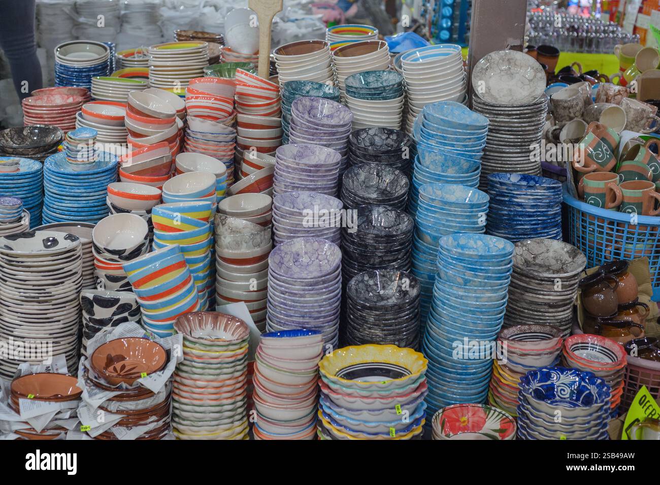 Ceramic pottery vessels stacked on the ground at a flea market in ...