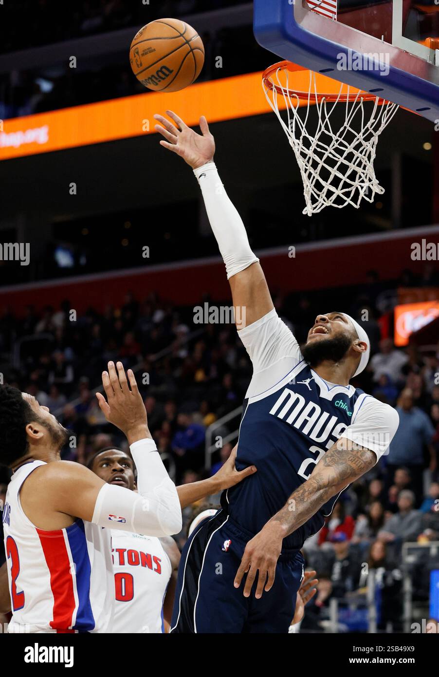 Dallas Mavericks center Daniel Gafford, right, lays up a shot past ...