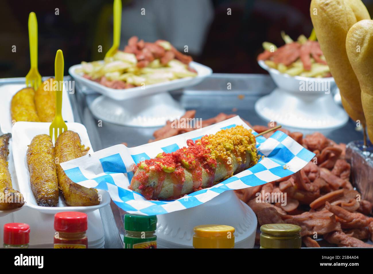 Junk food stand in Mexico. Banderillas with sauces Stock Photo - Alamy