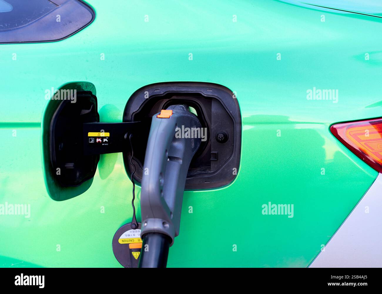 Electric car charging Stock Photo - Alamy