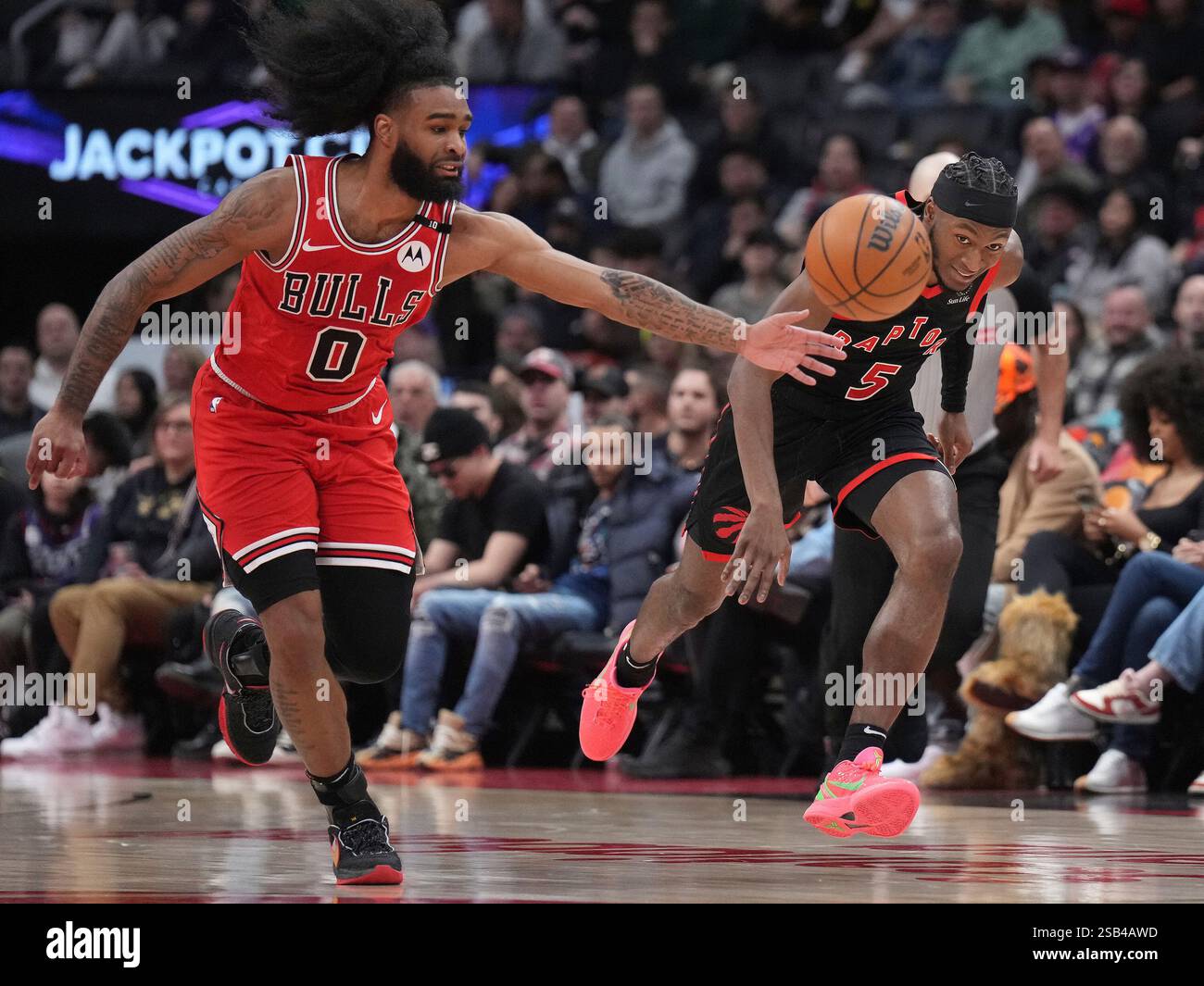 Chicago Bulls guard Coby White (0) and Toronto Raptors guard Immanuel ...