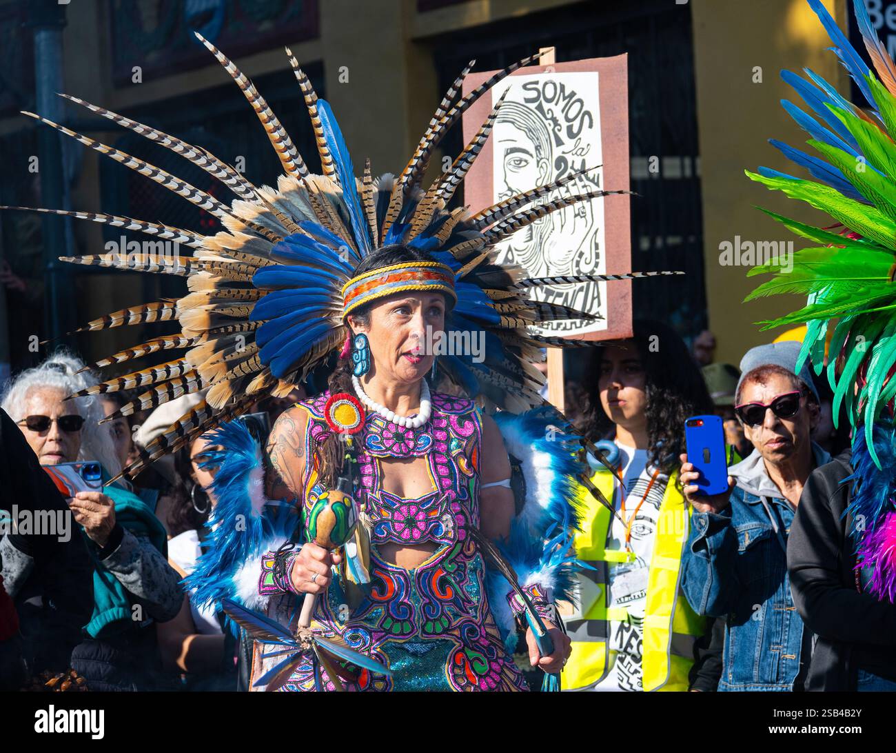 A Danza Azteca dancer performs at the Day of Resistance event in the ...