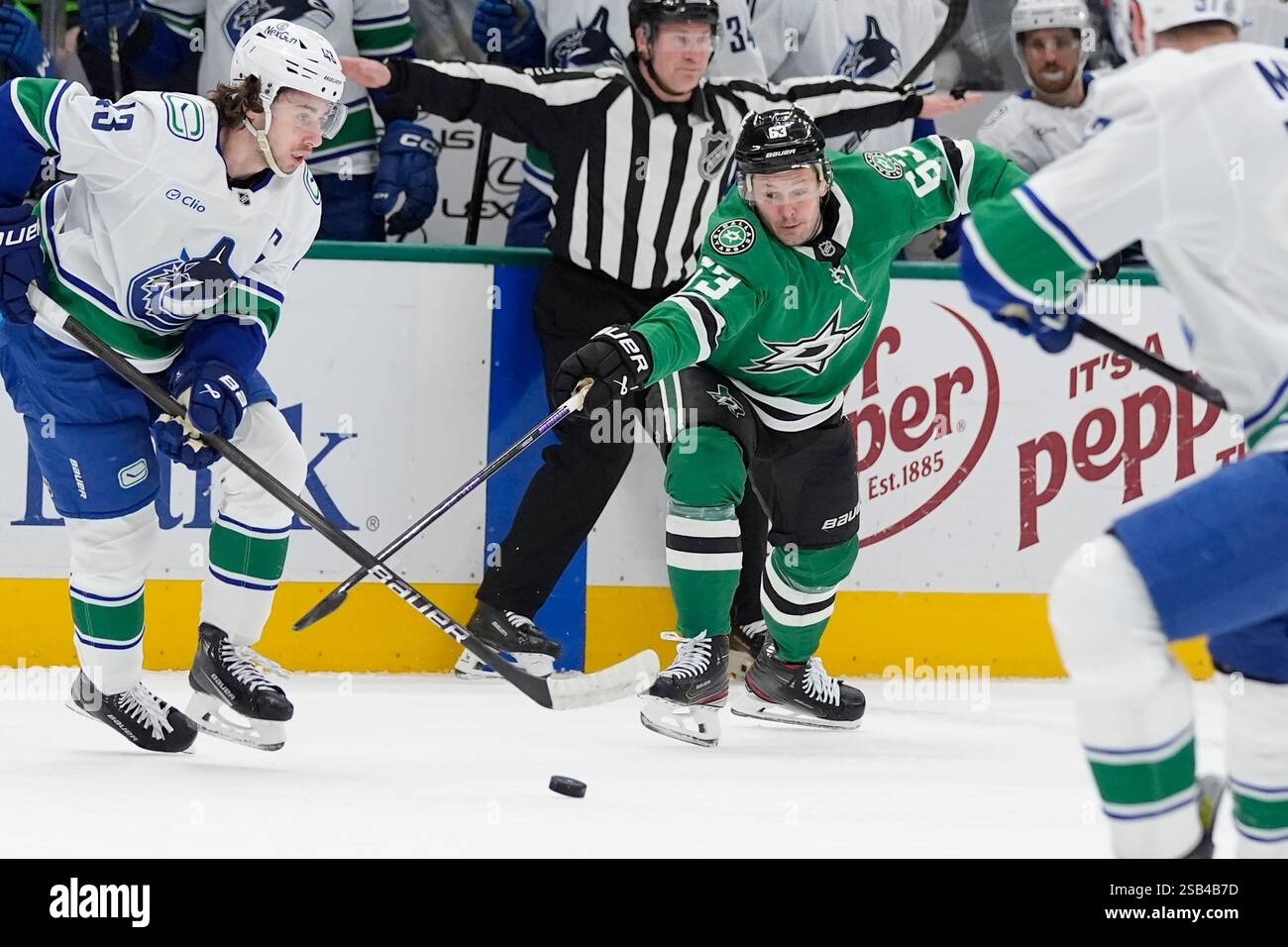 Dallas Stars right wing Evgenii Dadonov (63) reaches for the puck ...