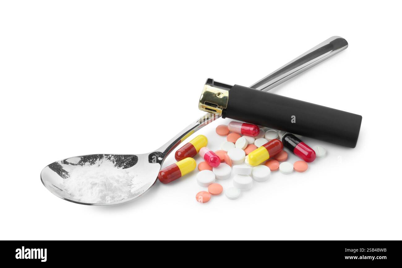 Drug addiction. Different pills, spoon with powder and cigarette ...