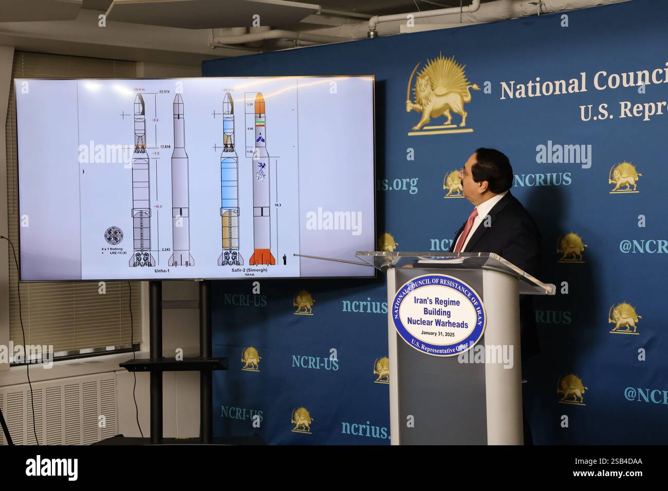 Alireza Jafarzadeh, the Deputy Director of NCRI-US, shows the graphics ...