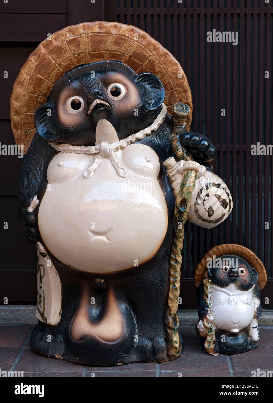 A tanuki (raccoon dog) figure ubiquitous in Japan symbolizing good luck ...