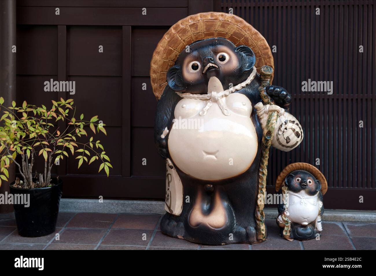 A tanuki (raccoon dog) figure ubiquitous in Japan symbolizing good luck ...