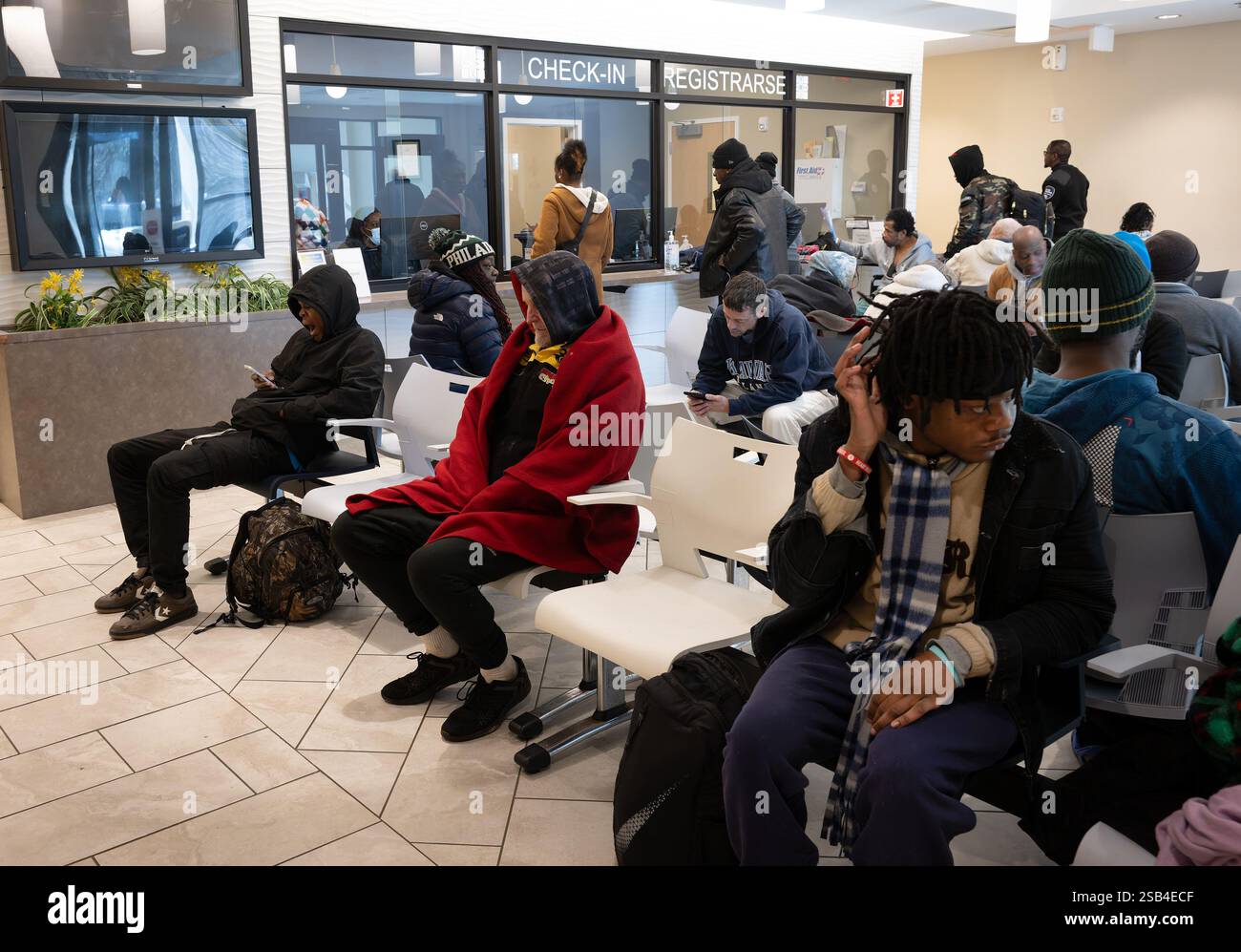 Marietta, Georgia, USA. 28th Jan, 2025. Homeless clients wait for ...