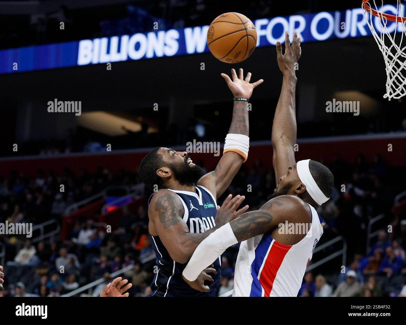 Dallas Mavericks guard Kyrie Irving, left, takes a shot against Detroit ...