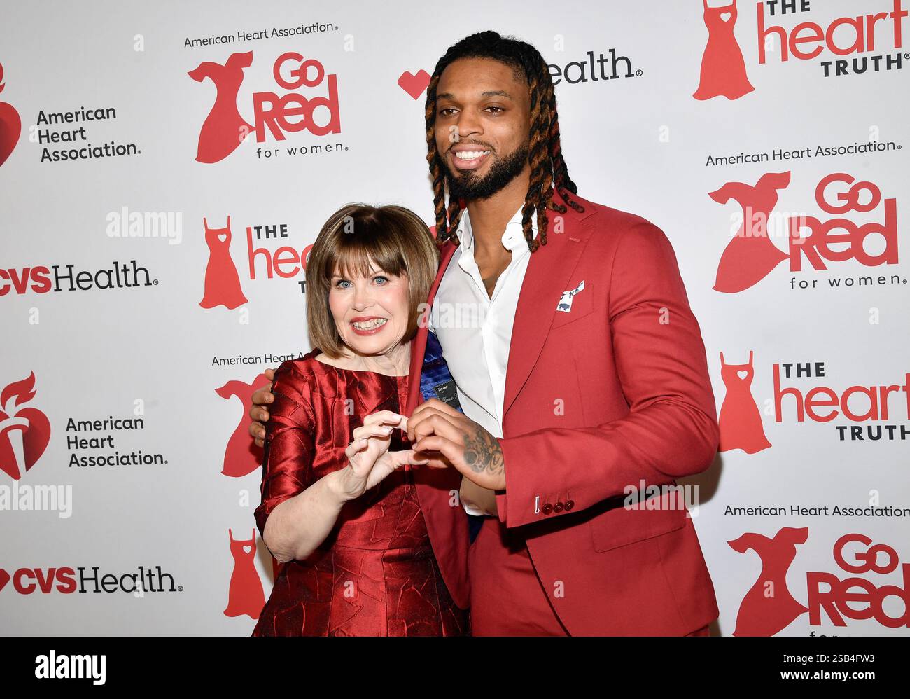 American Heart Association CEO Nancy Brown, left, and Damar Hamlin pose ...