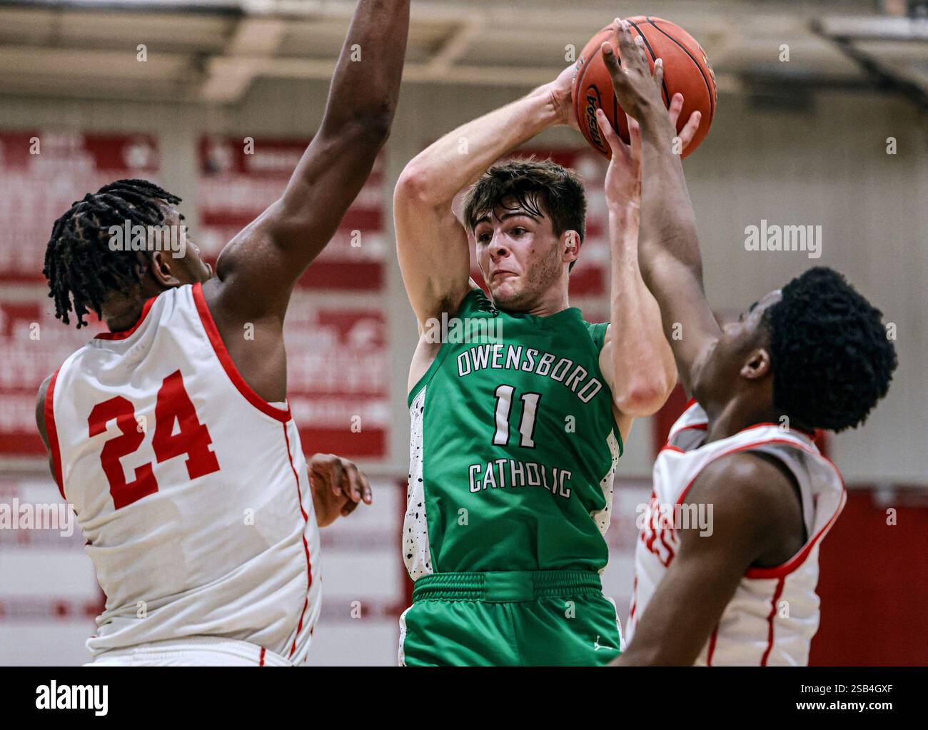 Owensboro Catholic's Luke Beickman (11) looks to shoot over Daviess ...
