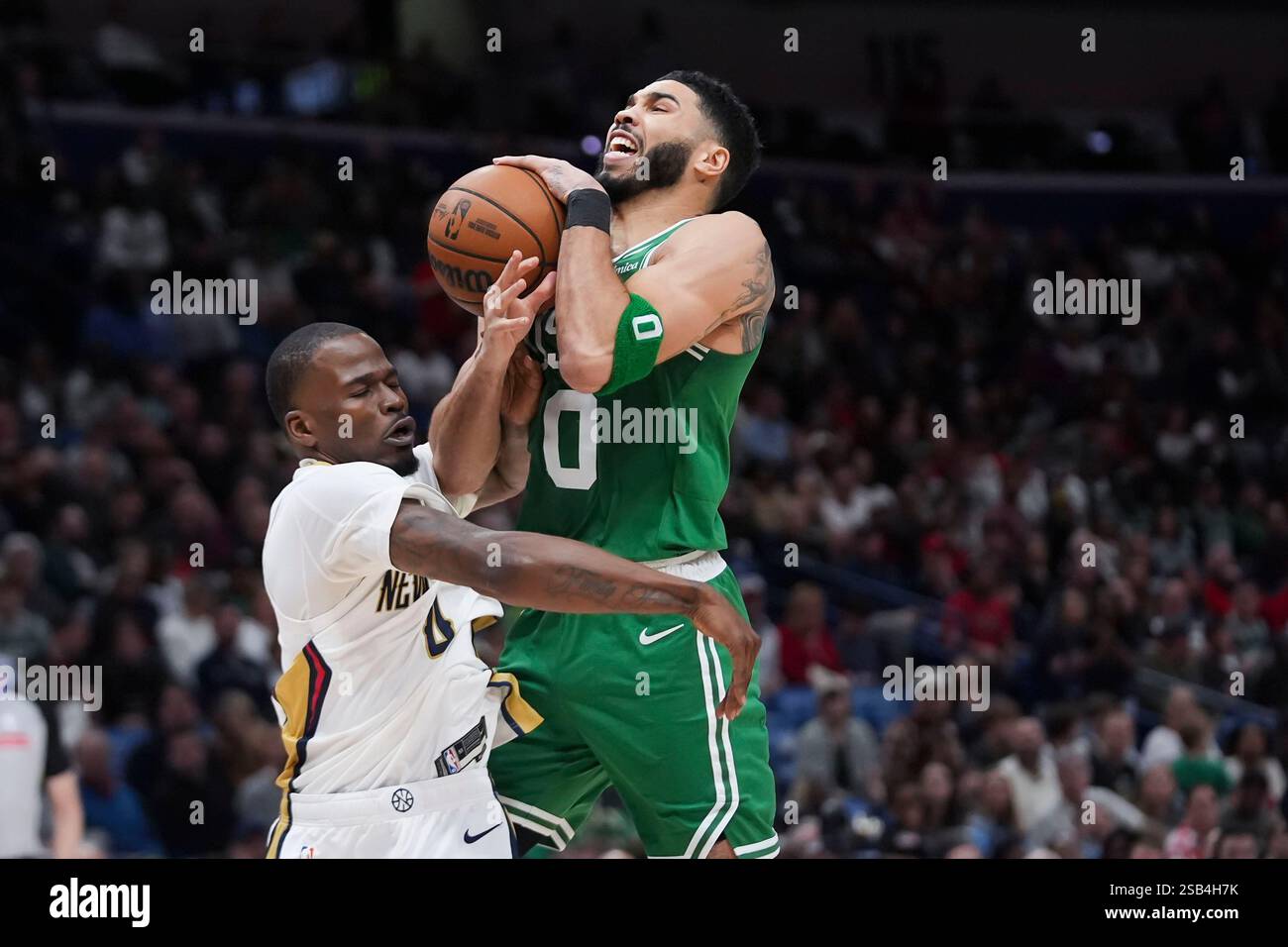 Boston Celtics forward Jayson Tatum (0) is fouled by New Orleans ...