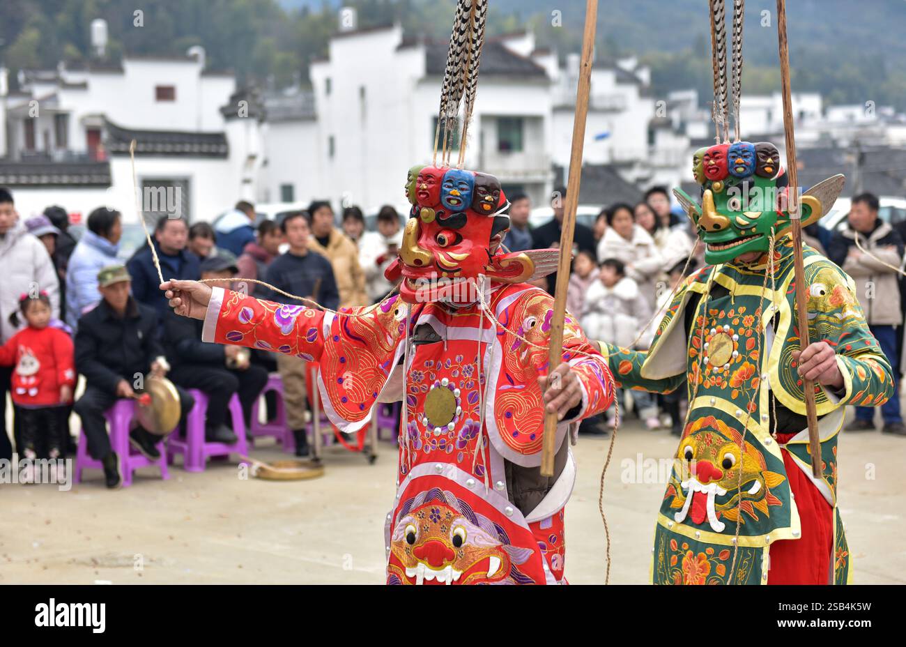 SHANGRAO, CHINA - JANUARY 30, 2025 - Artists watch a Nuo dance ...