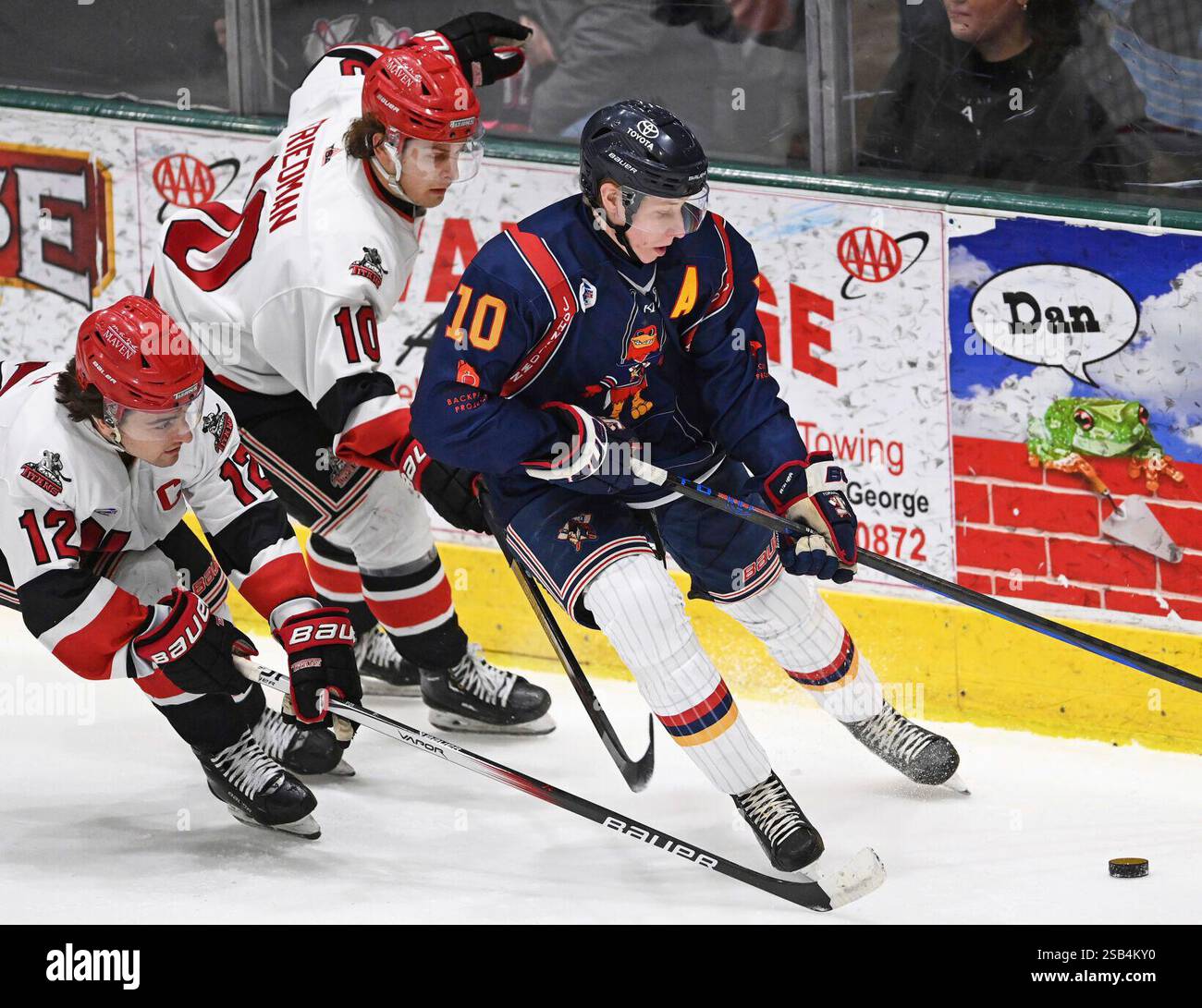 New Jersey Titans' Ryan Novo (12) and Ryan Friedman, top left, close in ...