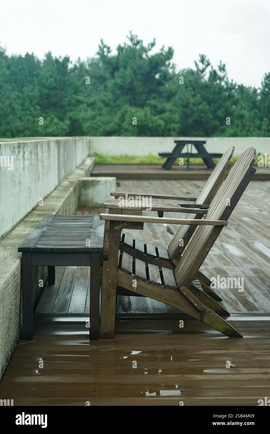 Wooden tables and chairs on the roof after the rain Stock Photo - Alamy