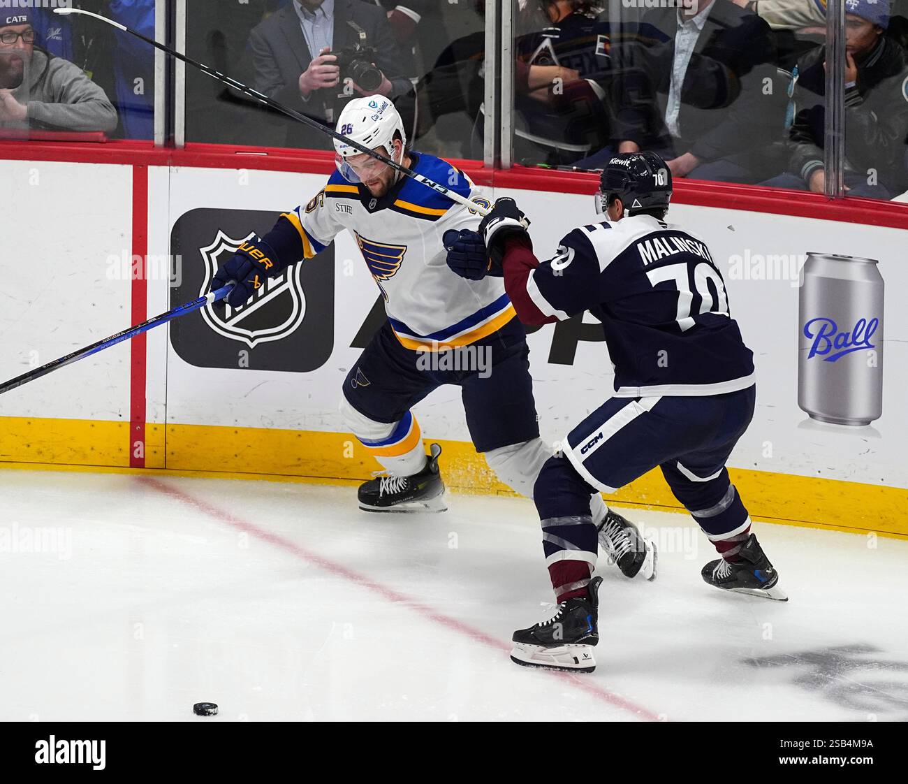 St. Louis Blues left wing Nathan Walker, left, fights for control of ...