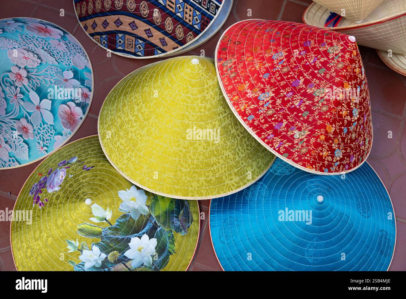 Traditional Vietnamese conical leaf hats for sale in market, warm ...