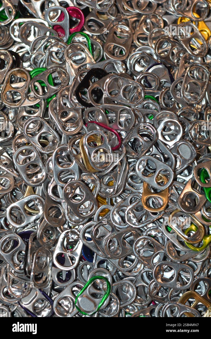 A pile of hundreds of drink tabs from aluminum soft drink (soda) and ...