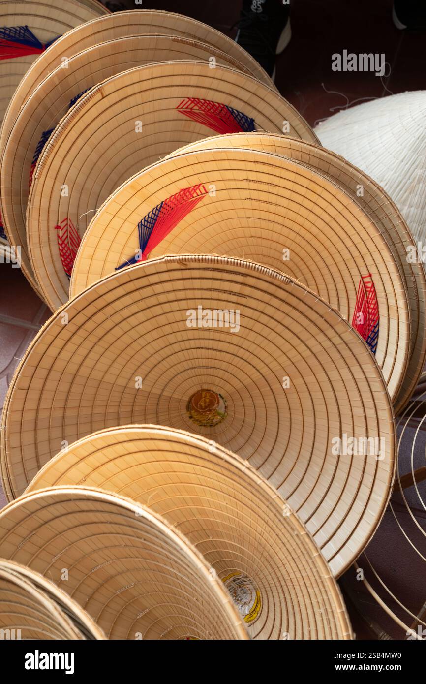 Traditional Vietnamese conical leaf hats for sale in market, warm ...