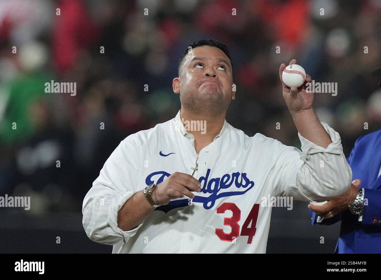 Fernando Valenzuela Jr. throws out the ceremonial first pitch before a ...